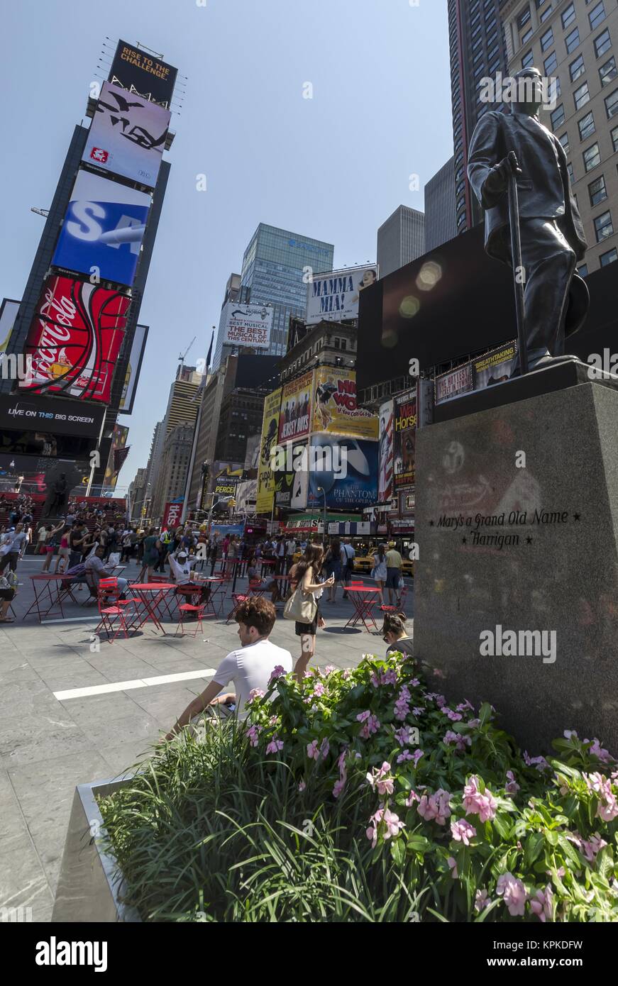 NEW YORK CITY - JULY 12: People sit in outdoor cafe at Times Square on ...