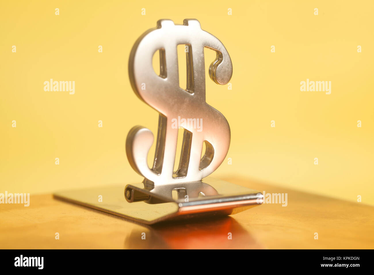 Dollar Sign on a Yellow Background Stock Photo - Alamy