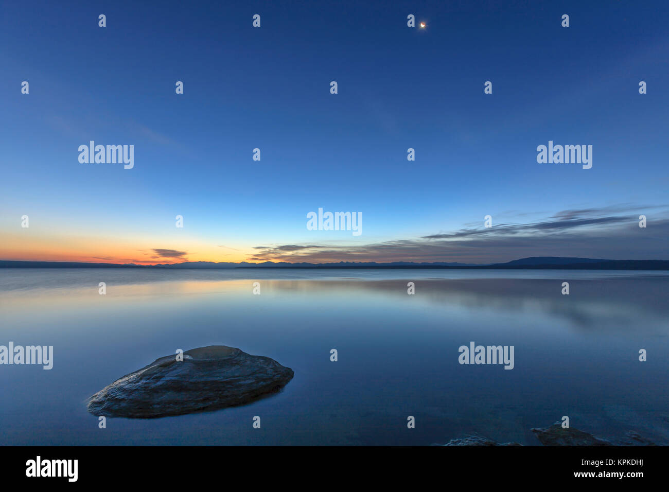 Sunrise and Moon setting over Yellowstone Lake. Yellowstone National ...