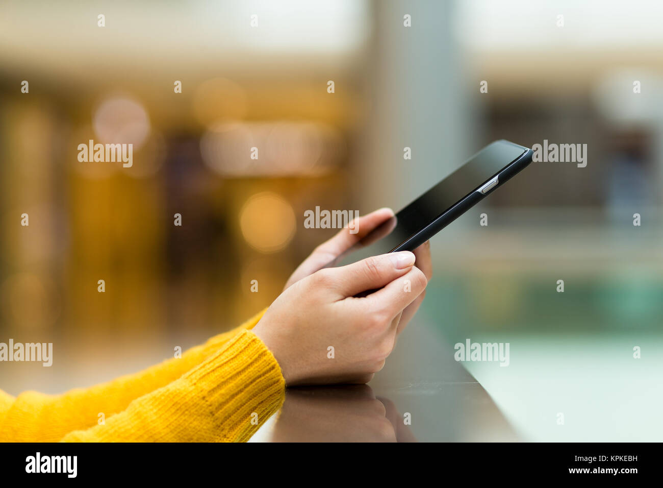 Woman use of smartphone at shopping mall Stock Photo - Alamy