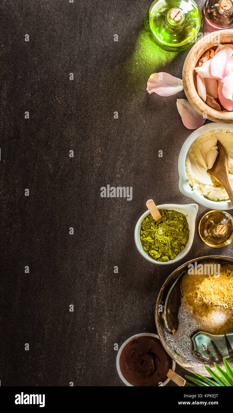 Narrow top down view of oils, salts and other body care objects in jars ...