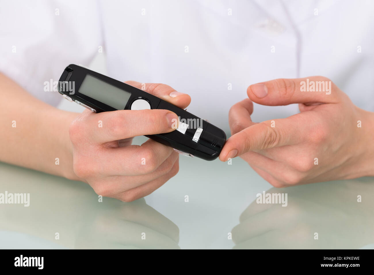Patient Hand Checking Blood Sugar Level With Glucometer Stock Photo - Alamy