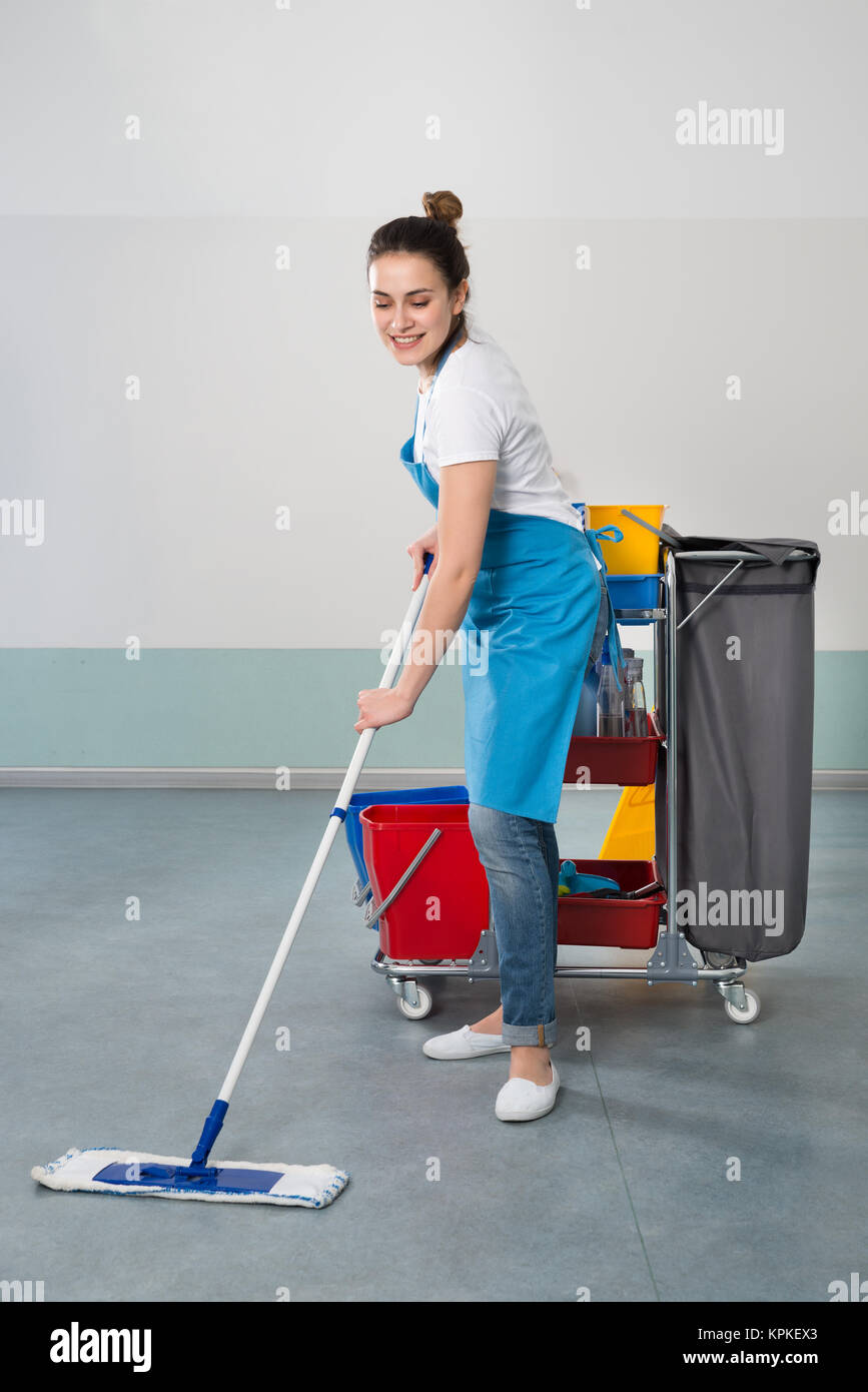 Happy Young Female Janitor Stock Photo - Alamy