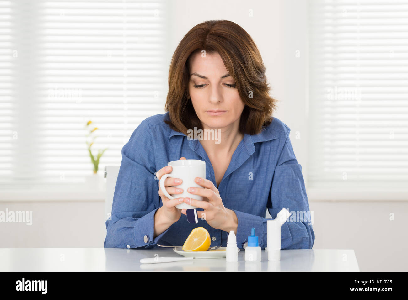 Sick Woman Drinking Lemon Tea Stock Photo - Alamy