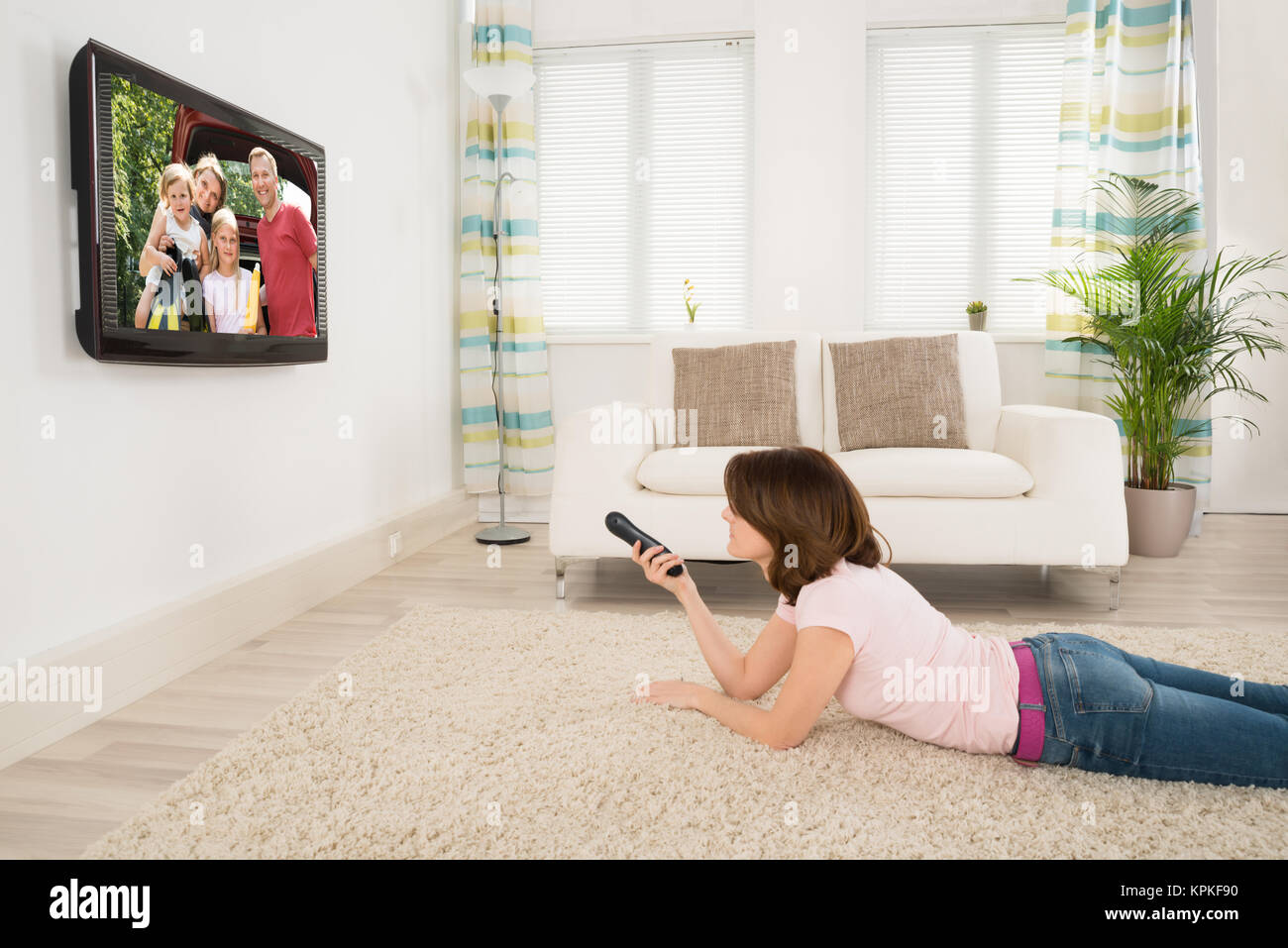 Young Woman Watching Television Stock Photo - Alamy