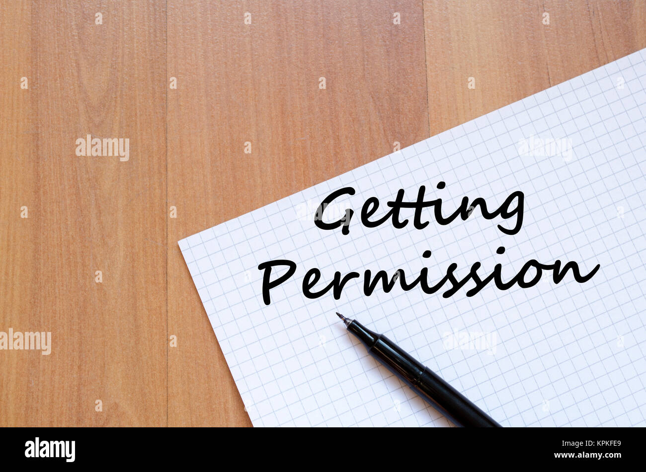 Getting permission write on notebook Stock Photo - Alamy
