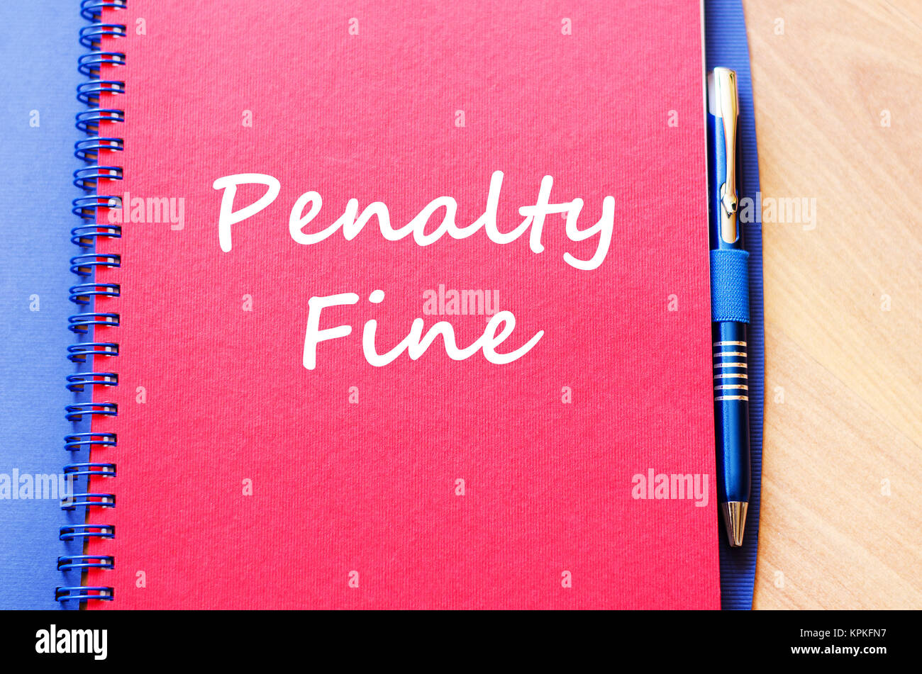 Penalty fine write on notebook Stock Photo - Alamy