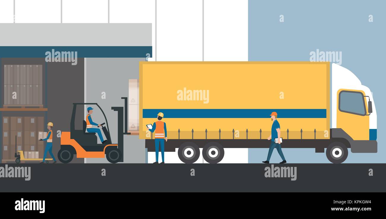 Workers loading the truck with packed goods at the industrial warehouse ...