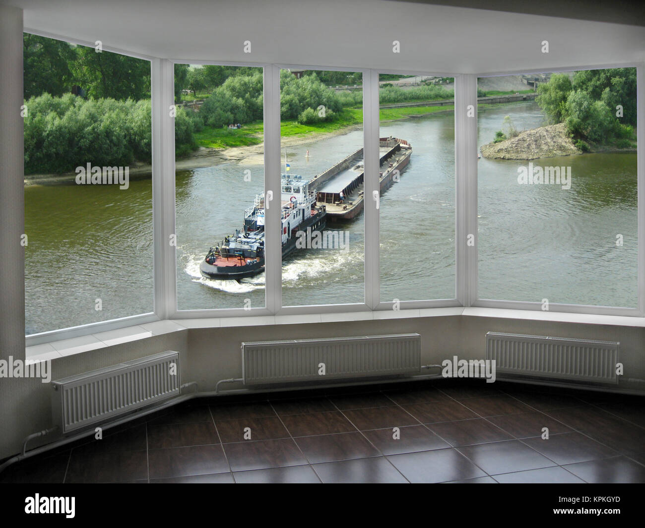 window with view of barge going on the river Stock Photo - Alamy