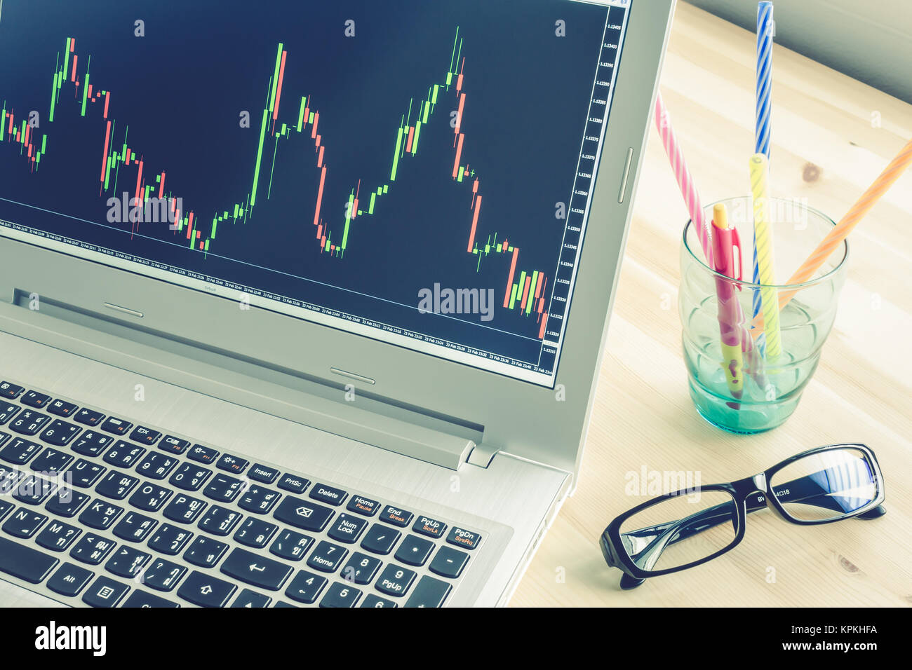Stock or Forex Graph in Laptop Screen on Blue Vintage Style Stock Photo ...