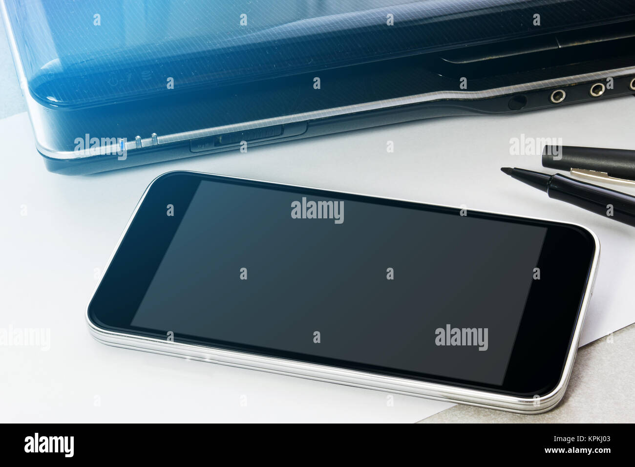 Workplace with mobile phone Stock Photo - Alamy