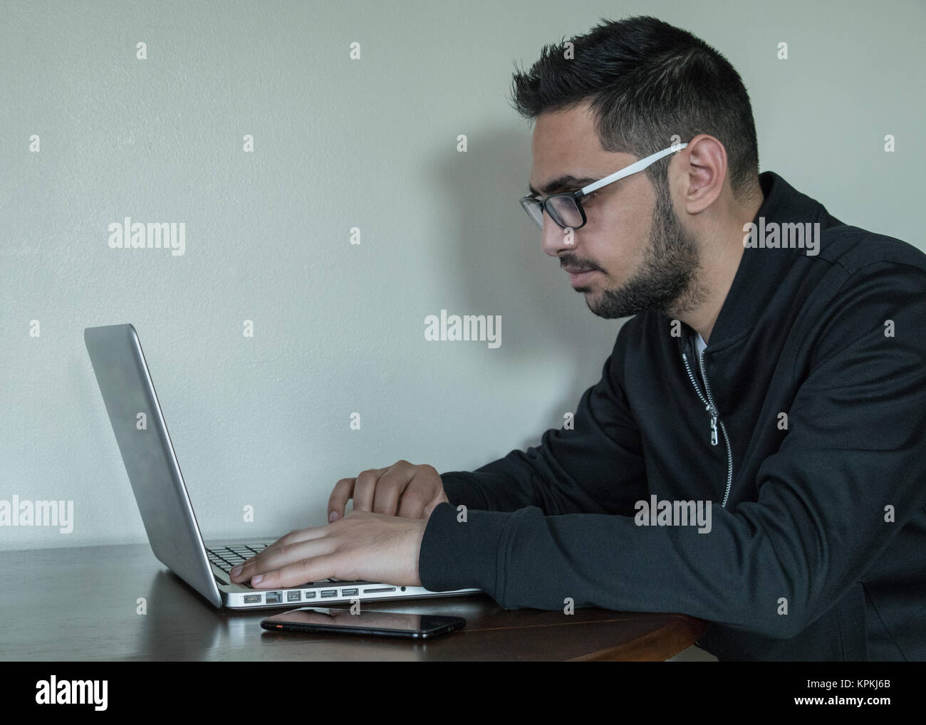 Young business man multitasking Stock Photo - Alamy