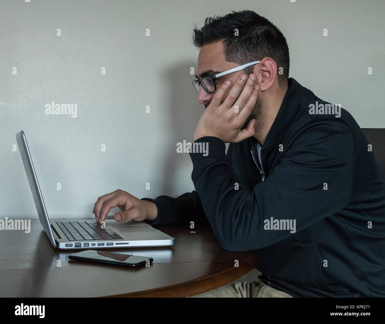 Young business man multitasking Stock Photo - Alamy