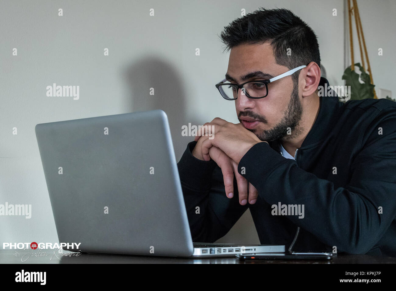 Young business man multitasking Stock Photo - Alamy