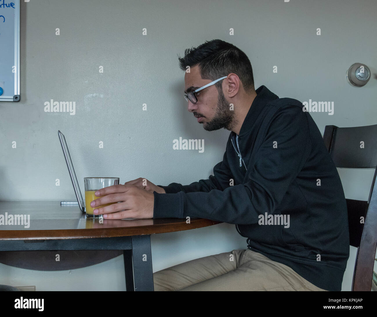 Young business man multitasking Stock Photo - Alamy