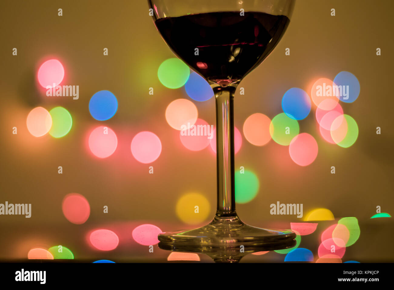Close up of a glass of wine with background lighting Stock Photo - Alamy
