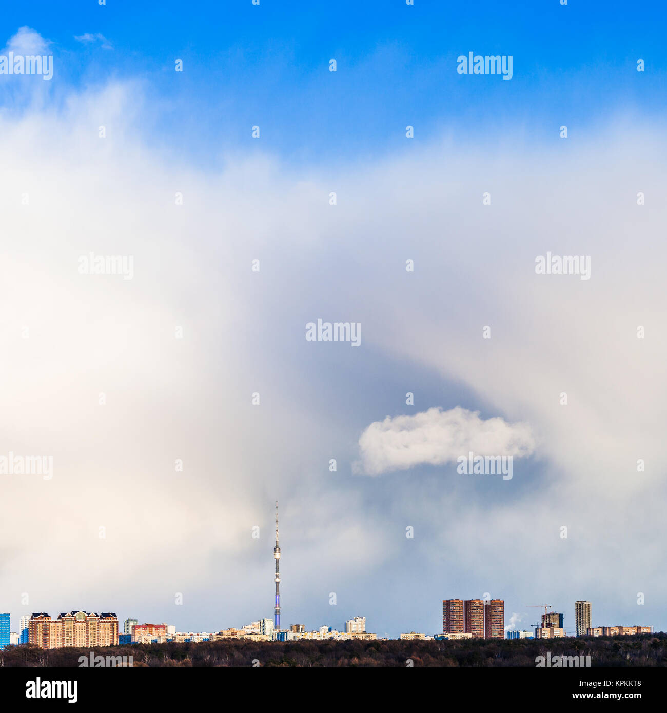 little snow cloud in large cumulus cloud over city Stock Photo - Alamy
