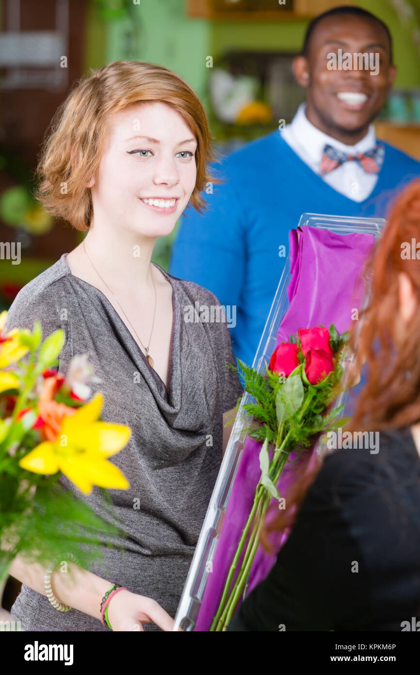 Teen Girl in Flower Shop Buys Roses Stock Photo - Alamy