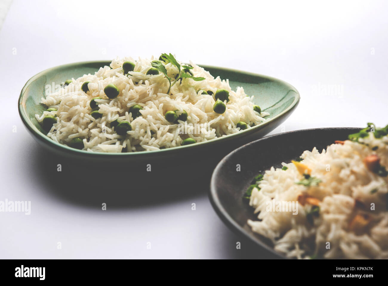group photo of indian rice with green peas and garlic served with jeera ...