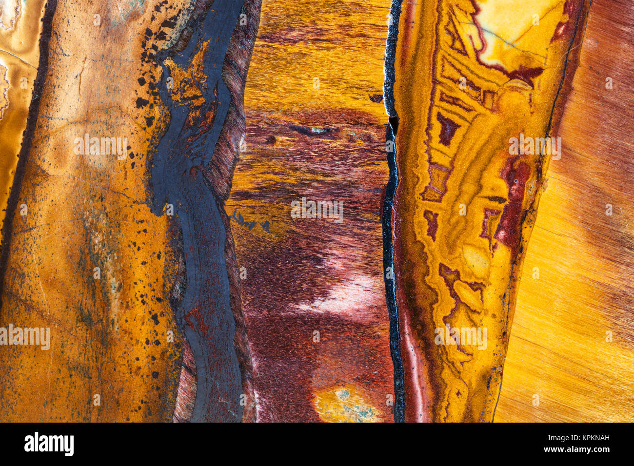 polished surface of Tiger's eye mineral gem stone Stock Photo - Alamy