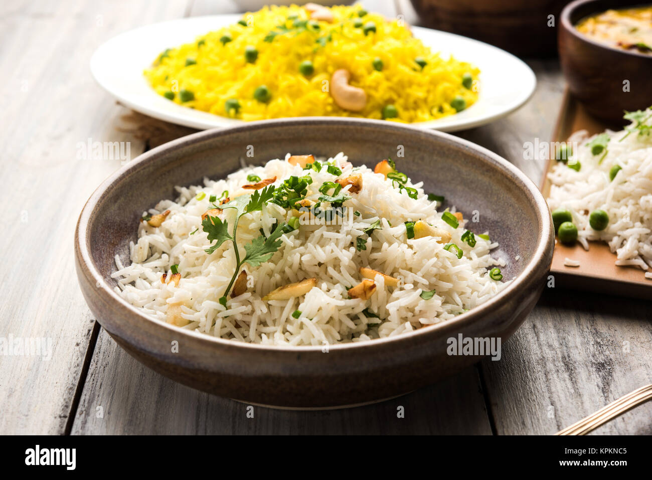 group photo of indian rice with green peas and garlic served with jeera ...