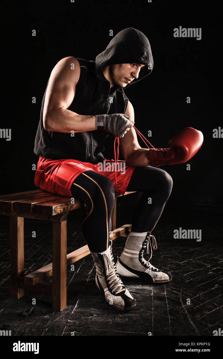 The young man kickboxing lacing glove Stock Photo - Alamy