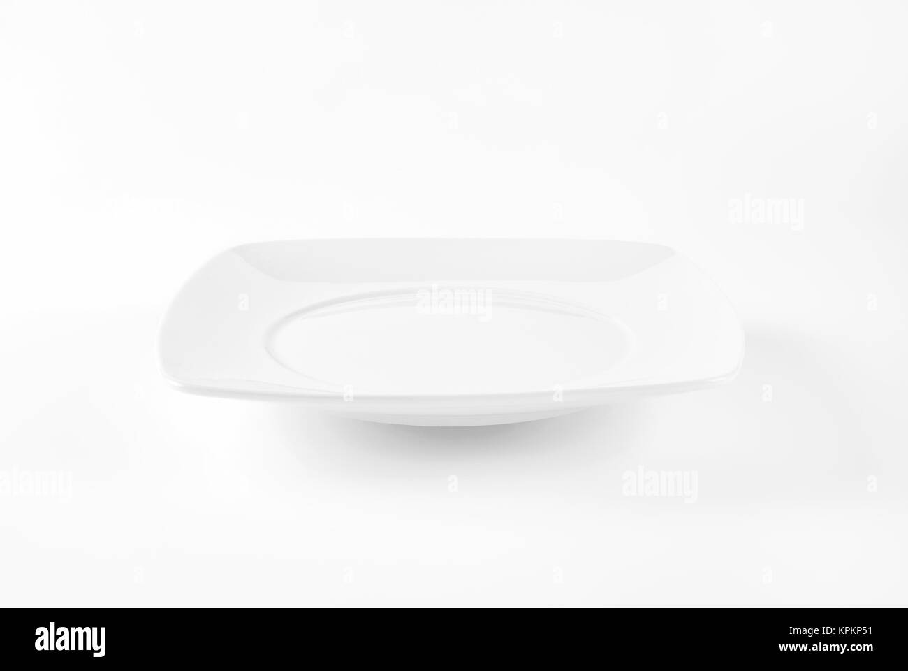 white square dinner plate Stock Photo - Alamy