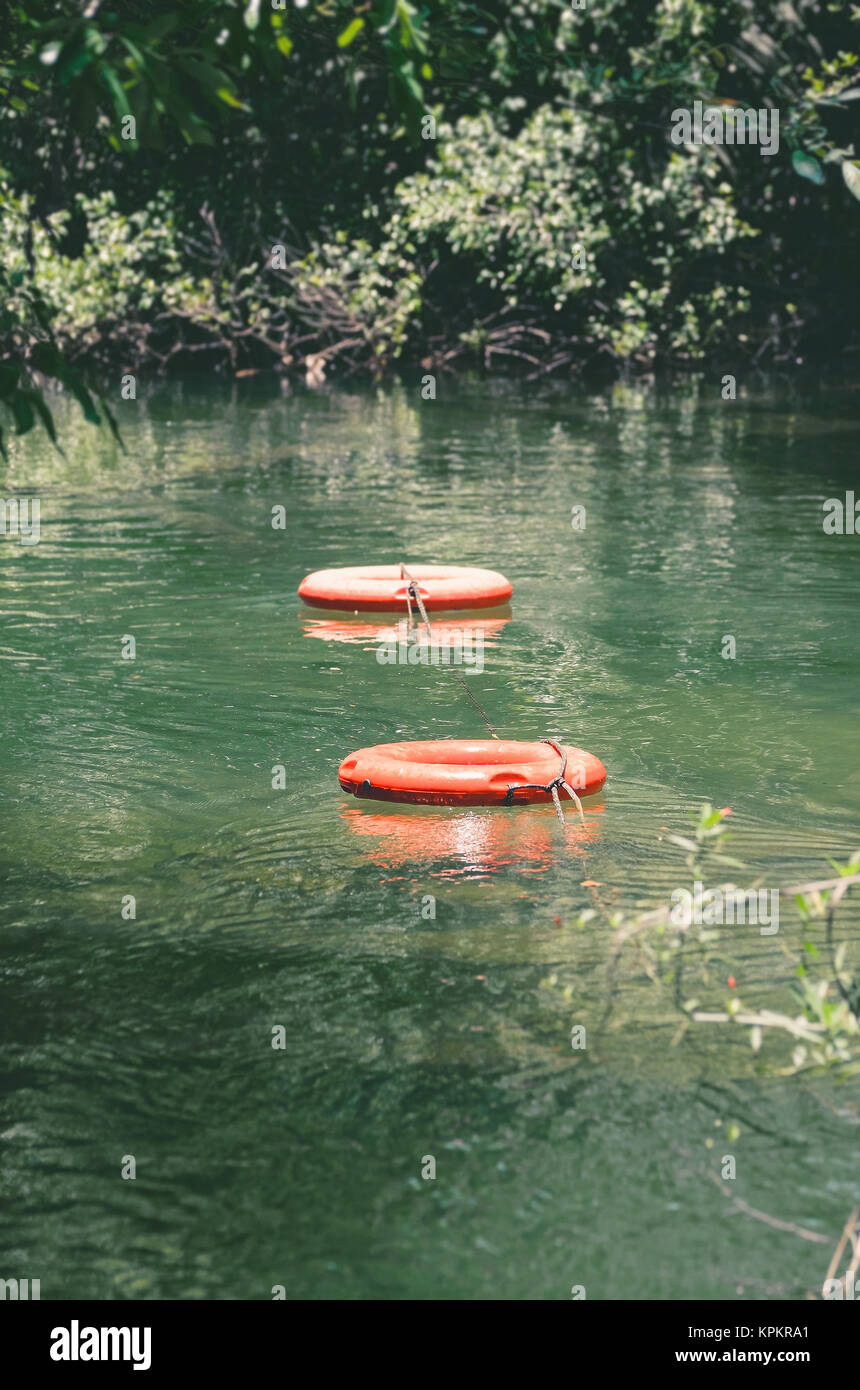 Life buoys floating on waters of Formoso river, a river with ...