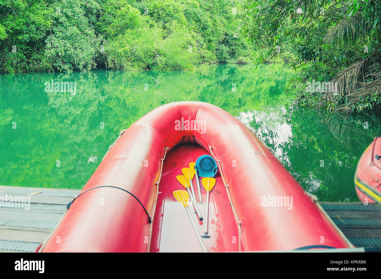 Red boat on the river. River with green water, beautiful nature ...