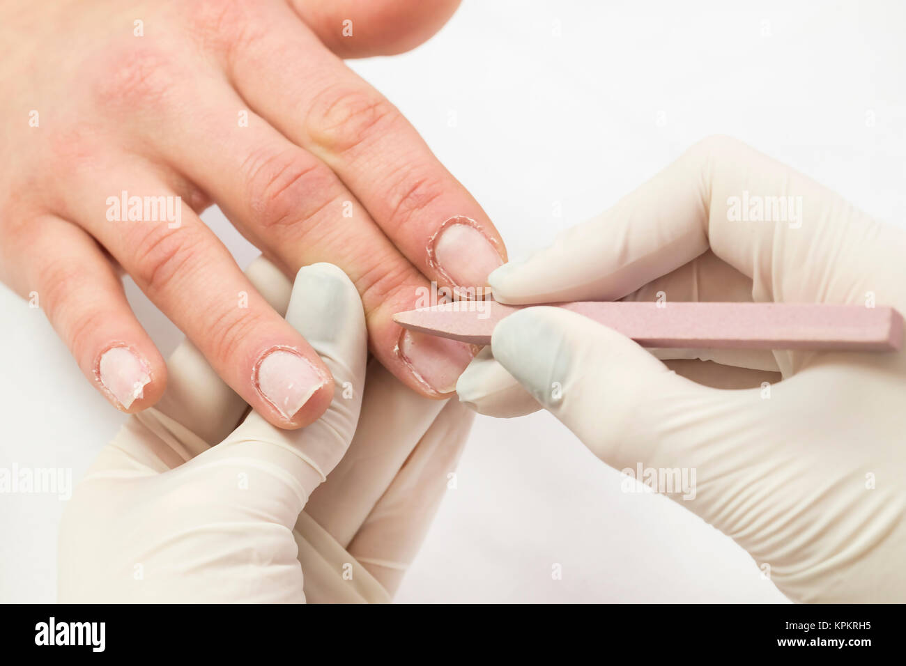 The process of the master's work in the manicure salon of female nails ...