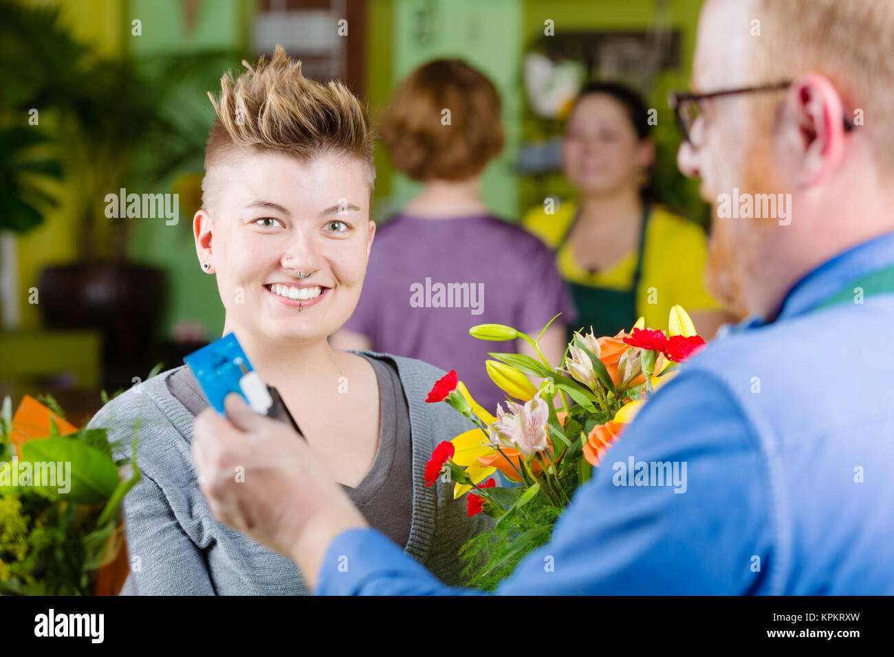 Cute Flower Shop Customer using Credit Stock Photo - Alamy