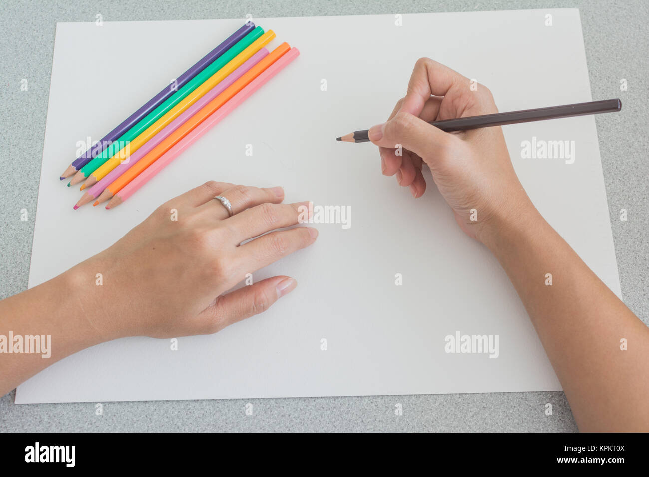 Person sketching with colored pencils Stock Photo - Alamy