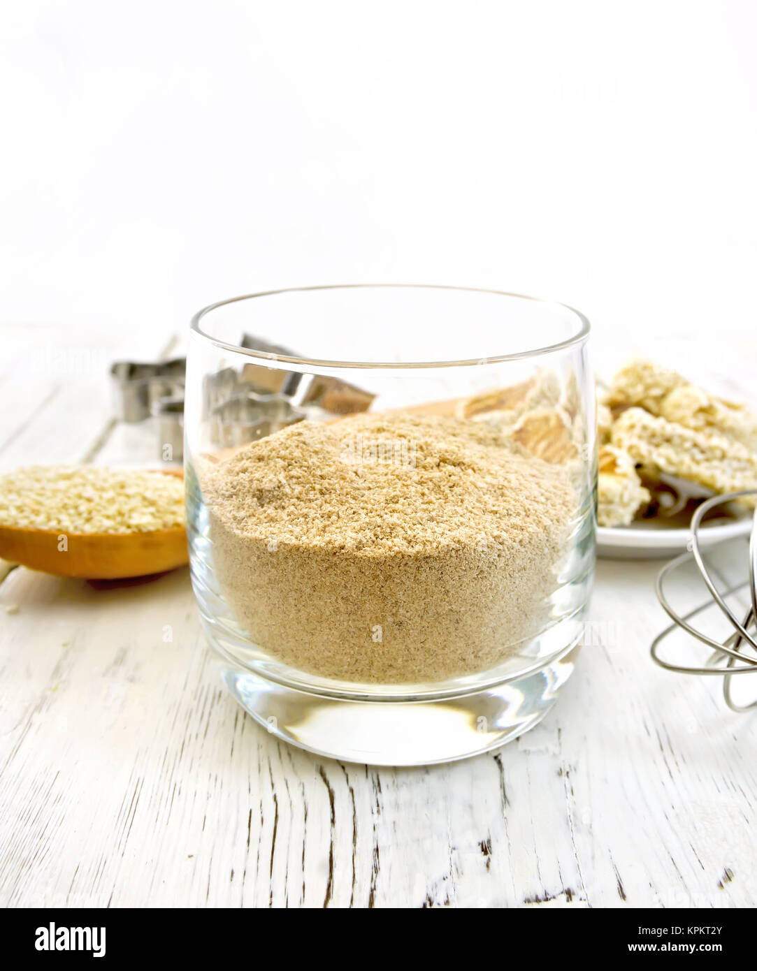 Flour sesame in glassful on board Stock Photo - Alamy