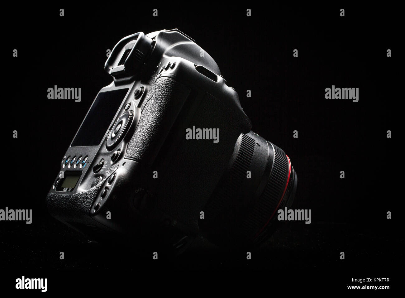 Professional modern DSLR camera low key image - Modern DSLR camera with ...