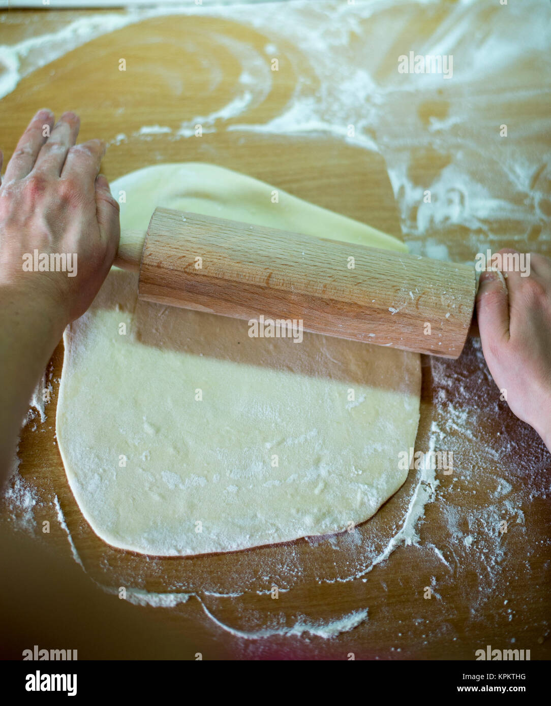 Female baker flattening dough hi-res stock photography and images - Alamy