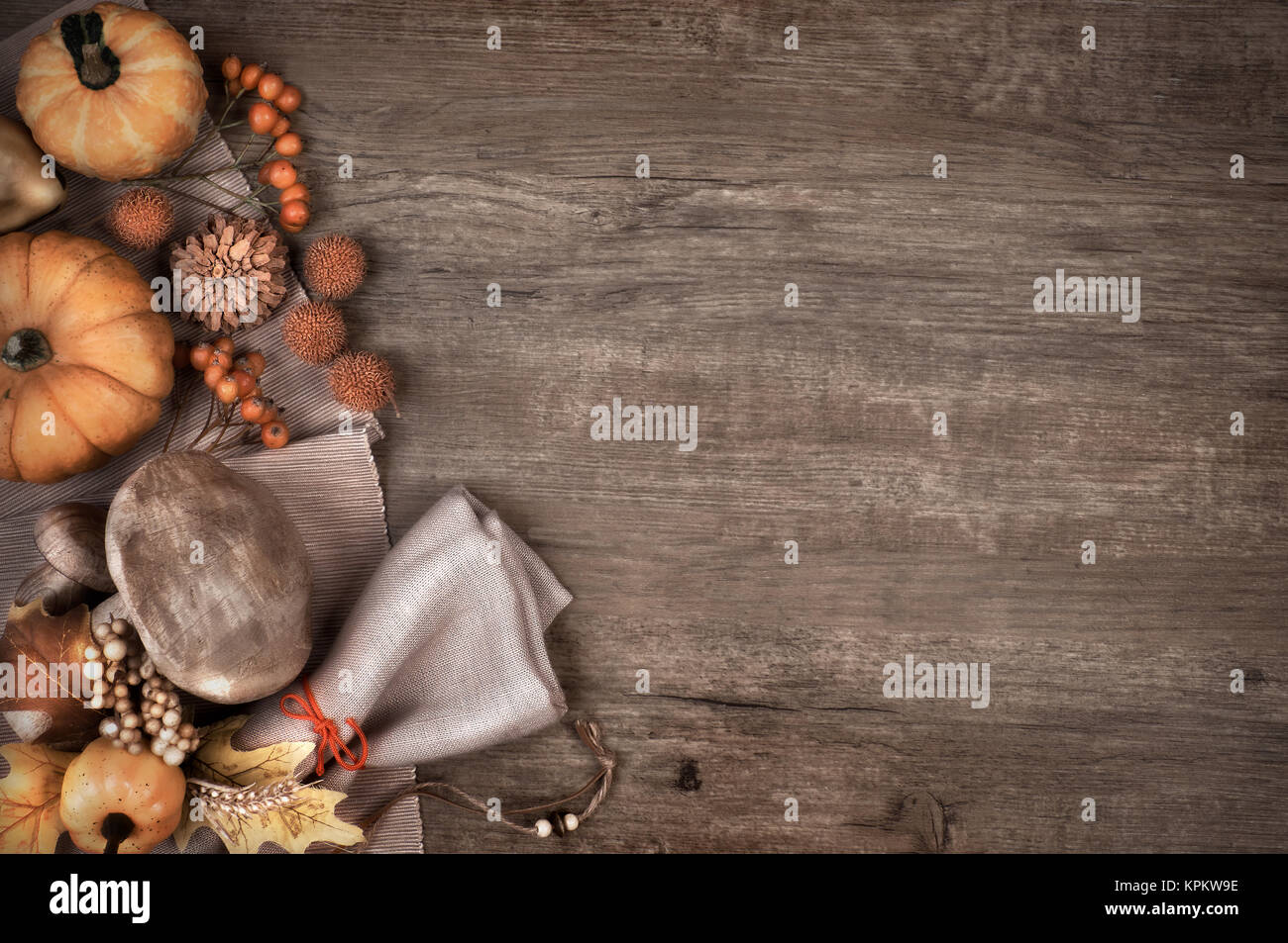 Autumn background with Fall dry decorations on wood. Side view, toned ...