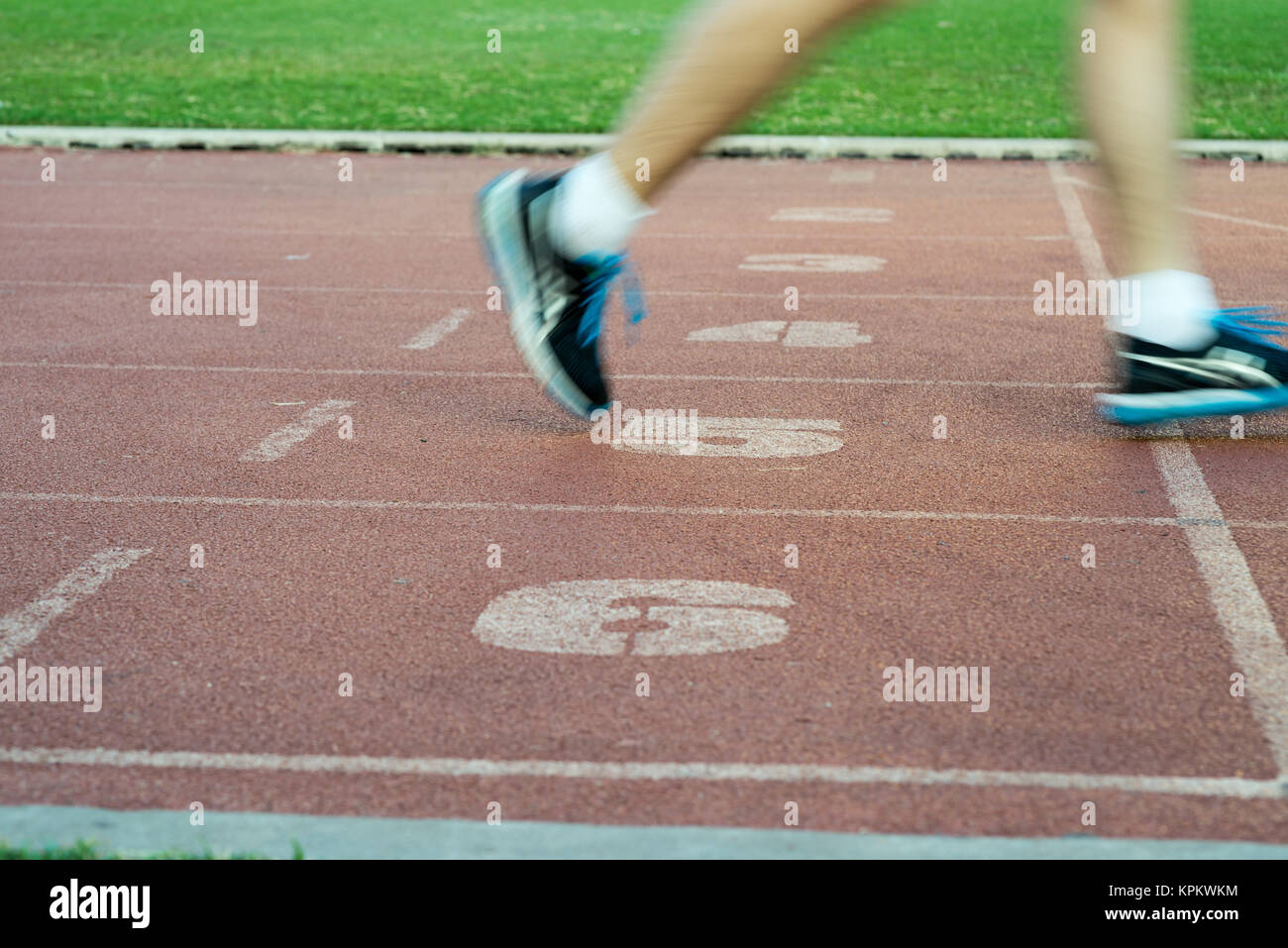 Runners feet in motion on track Stock Photo - Alamy