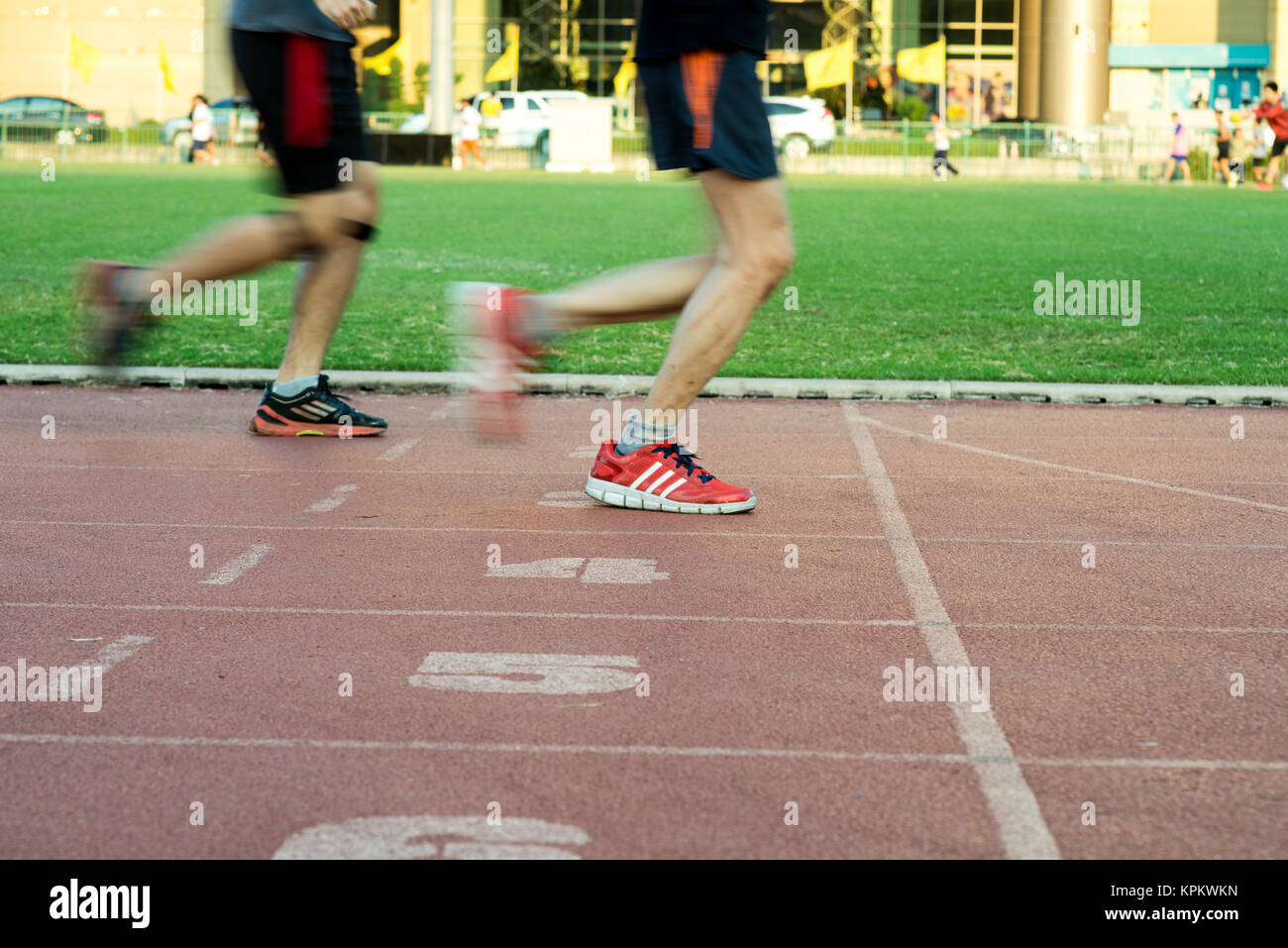 Runners feet in motion on track Stock Photo - Alamy