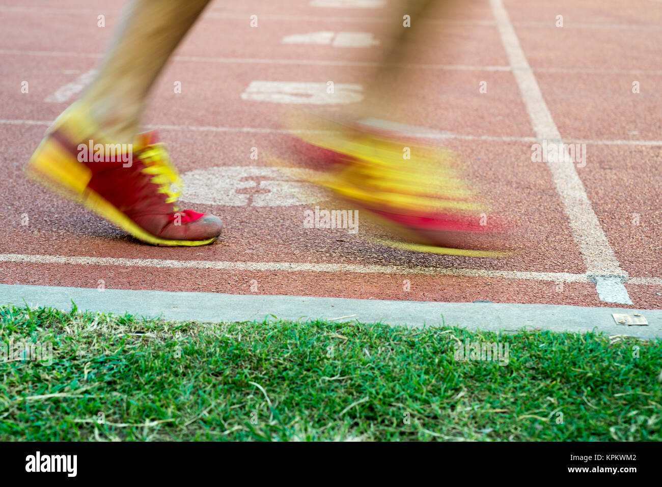 Runners feet in motion on track Stock Photo - Alamy