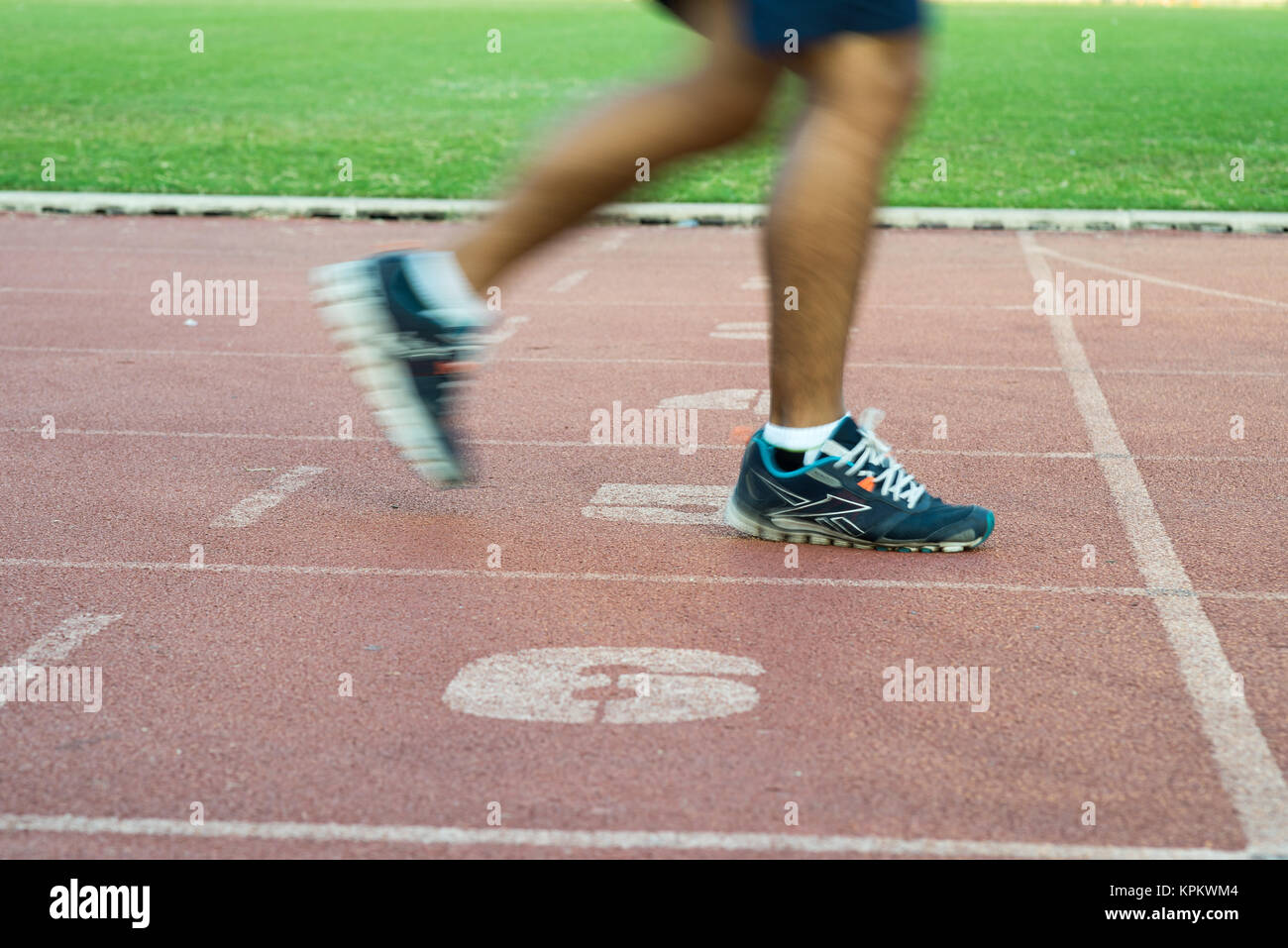 Runners feet in motion on track Stock Photo - Alamy