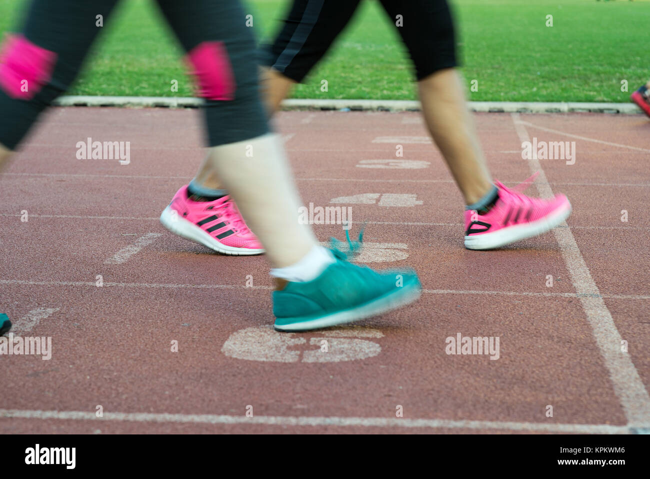 Runners feet in motion on track Stock Photo - Alamy