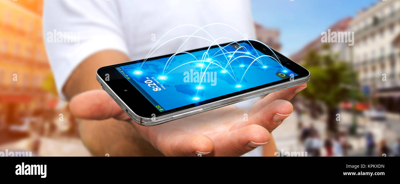 Young man using modern mobile phone Stock Photo - Alamy