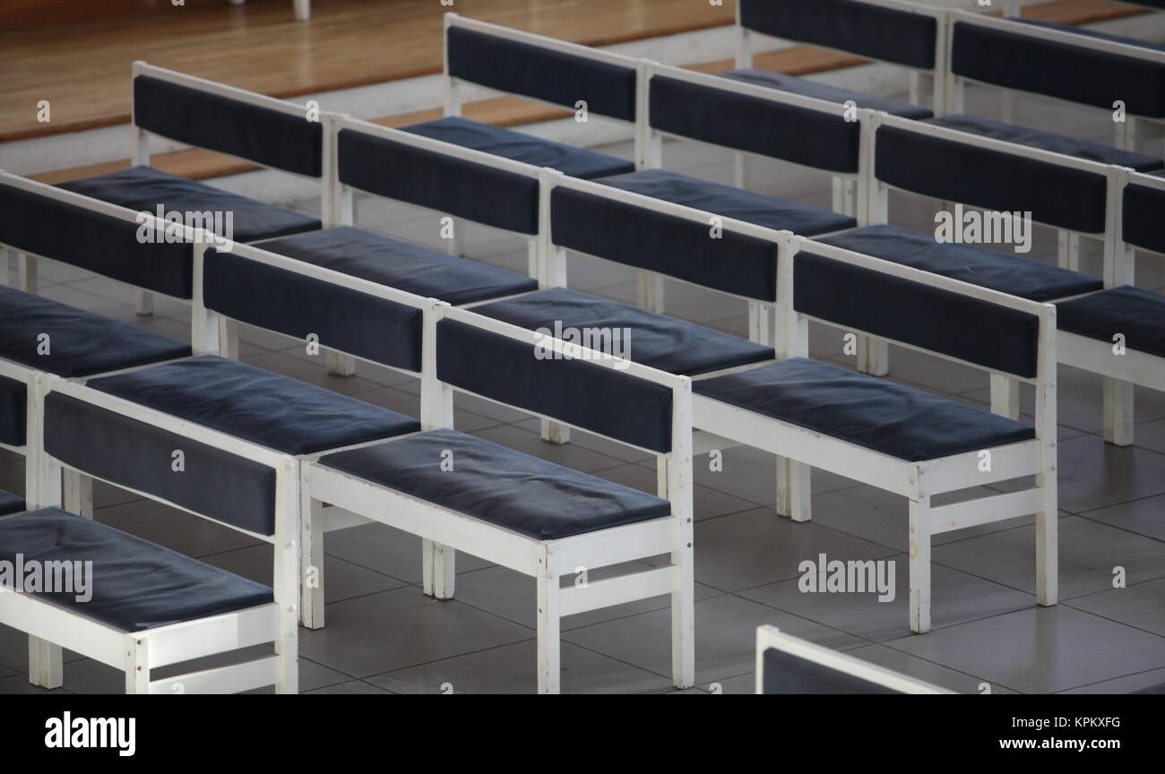 Row of benches inside a church Stock Photo - Alamy