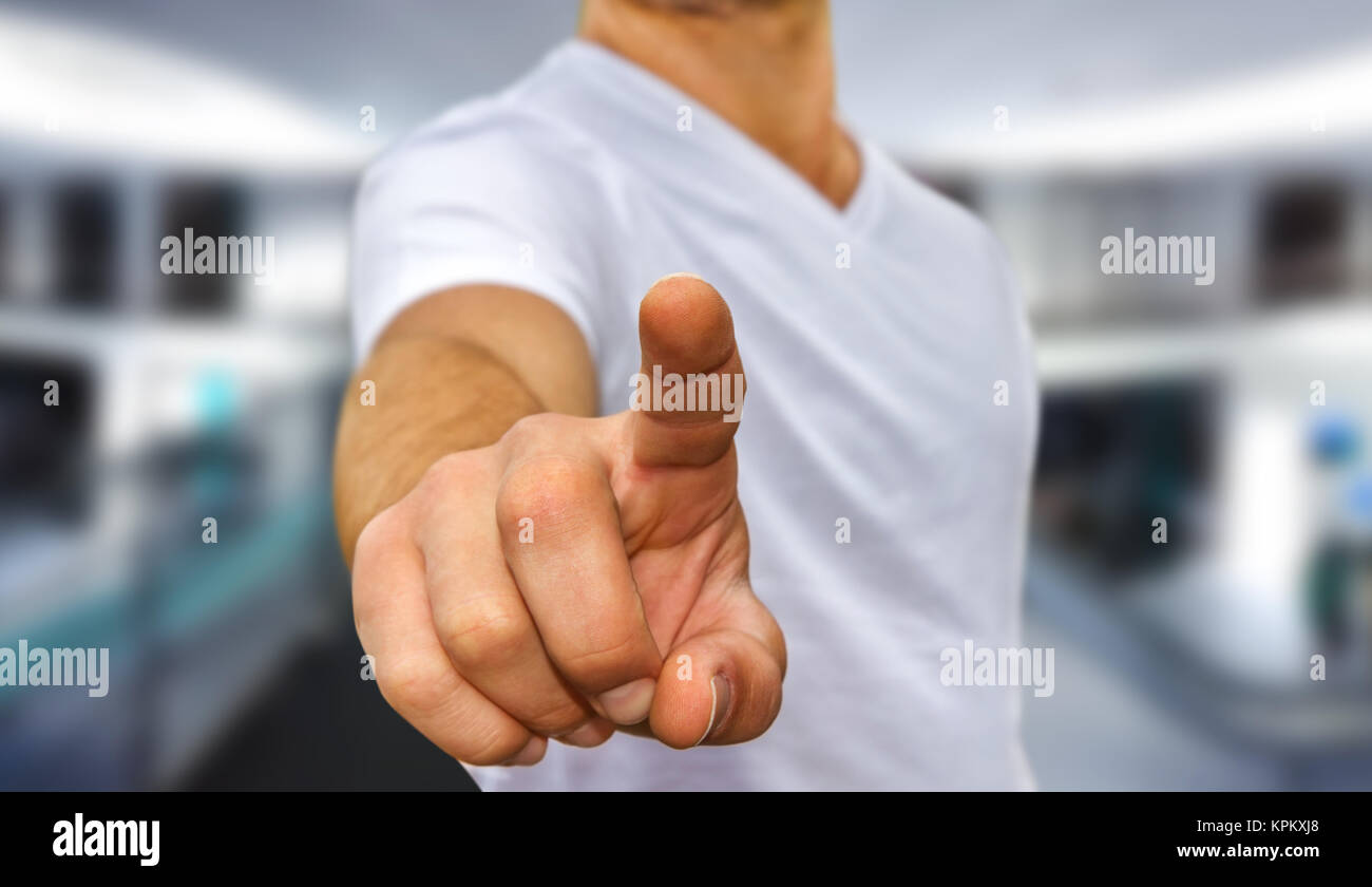 Young man pointing finger Stock Photo - Alamy