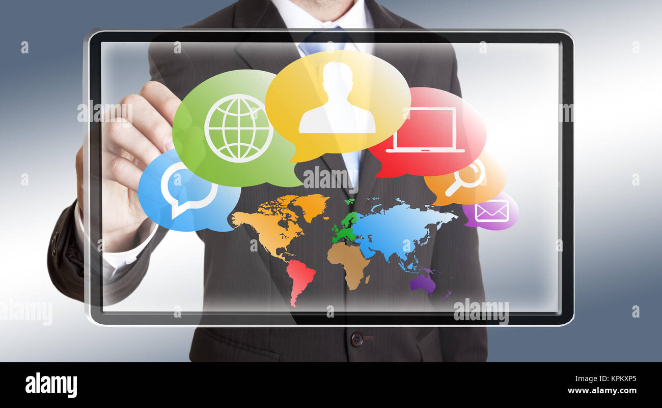 Businessman using multimedia elements Stock Photo - Alamy