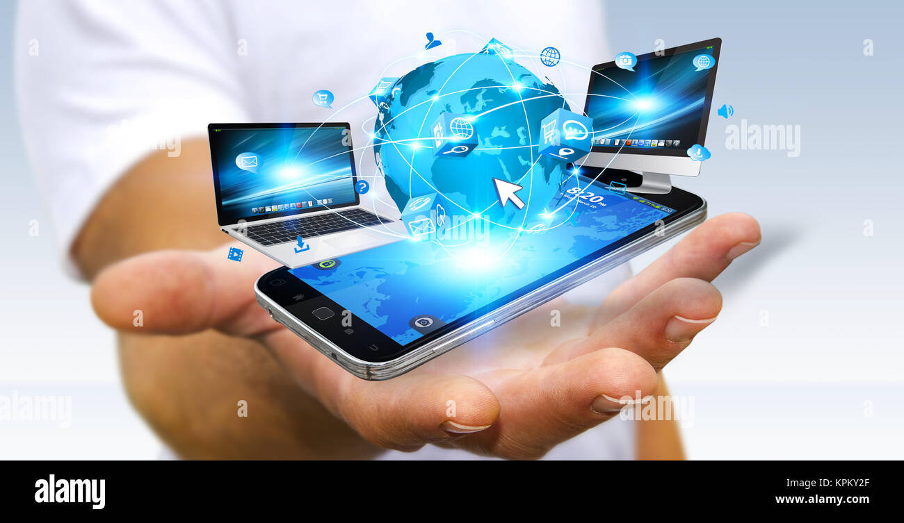 Businessman connecting tech devices Stock Photo - Alamy