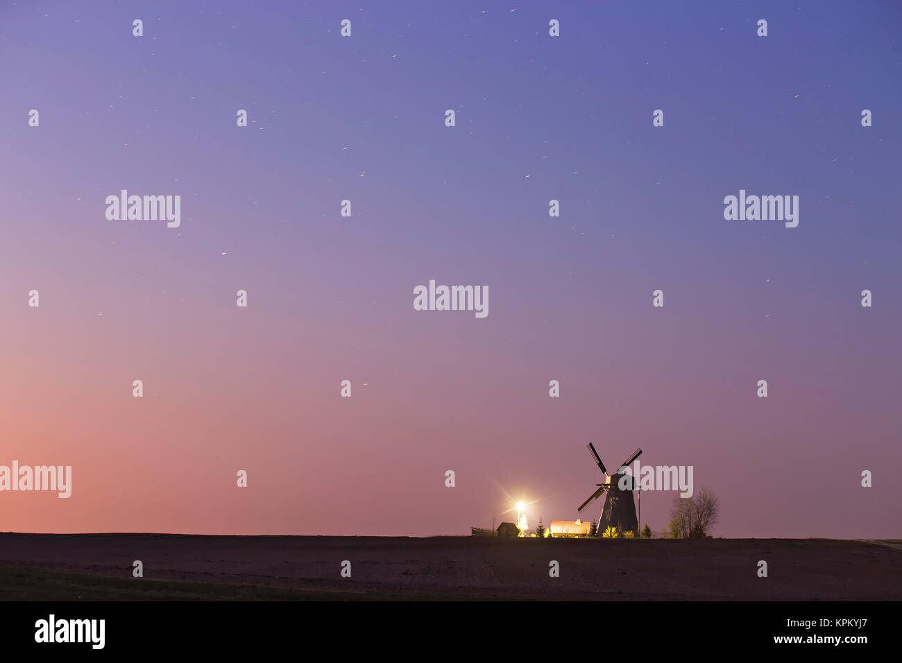 Old windmill in a starry spring night Stock Photo - Alamy