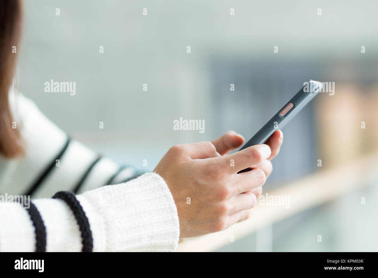 Student using smart phone in campus Stock Photo - Alamy