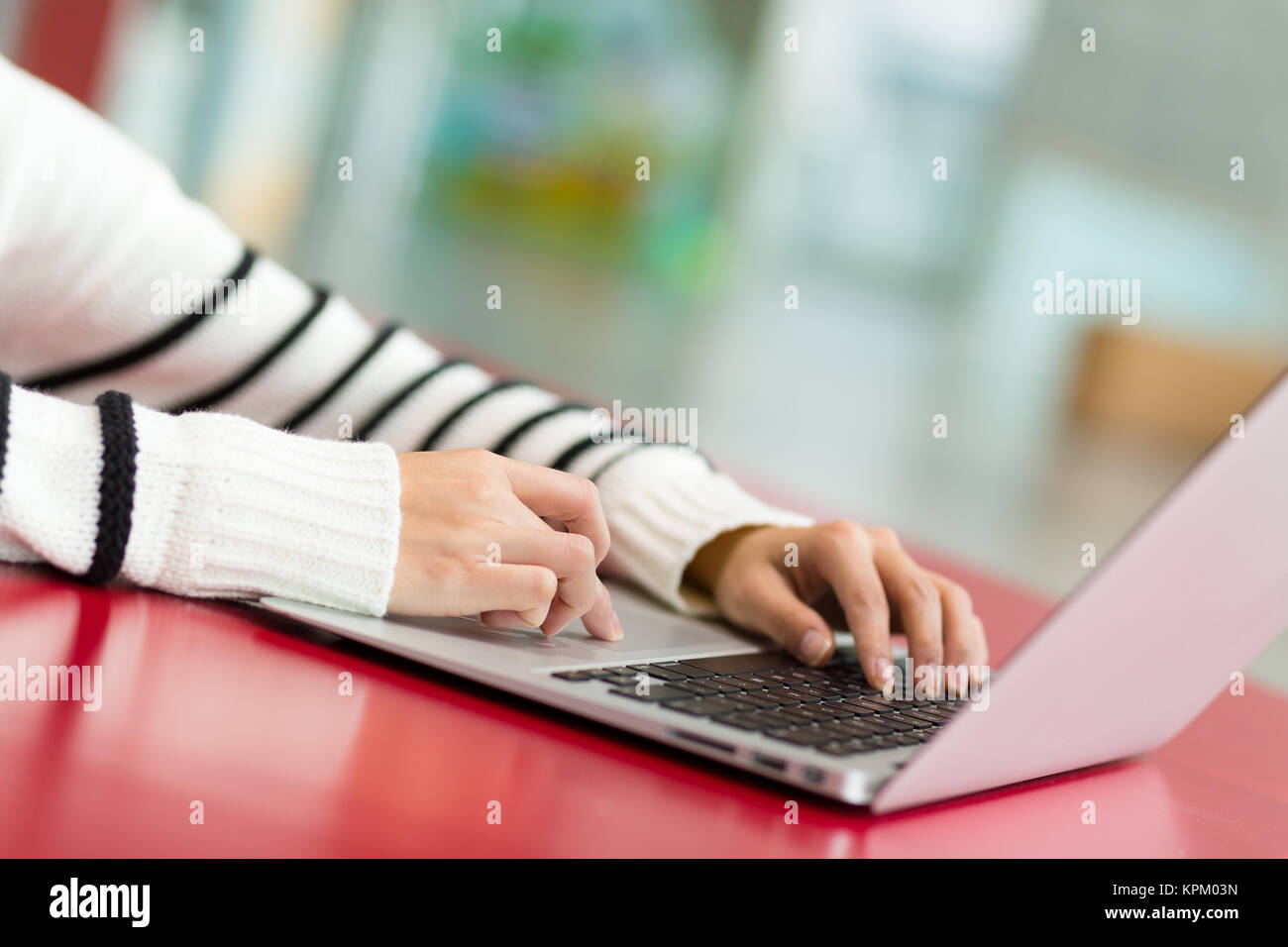 Woman typing on laptop computer Stock Photo - Alamy
