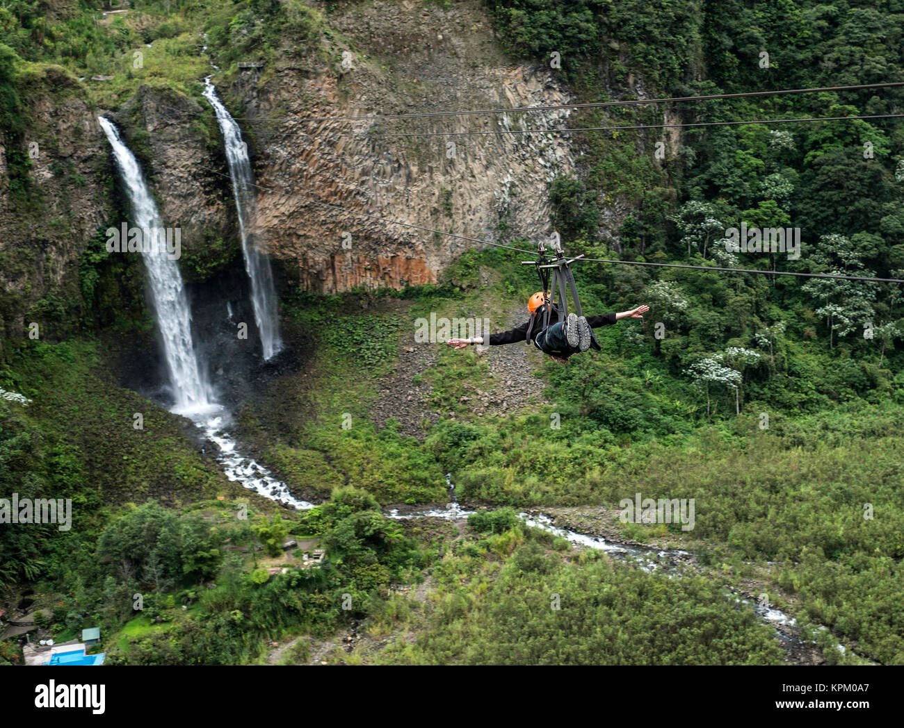 Tourist gliding on the zip line trip against Bridal veil (Manto de la ...